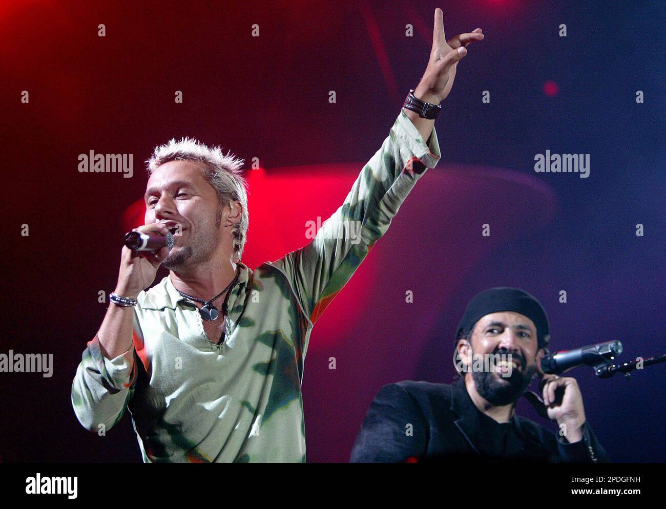 Dominican Republic's singer Juan Luis Guerra,right listens sing ...
