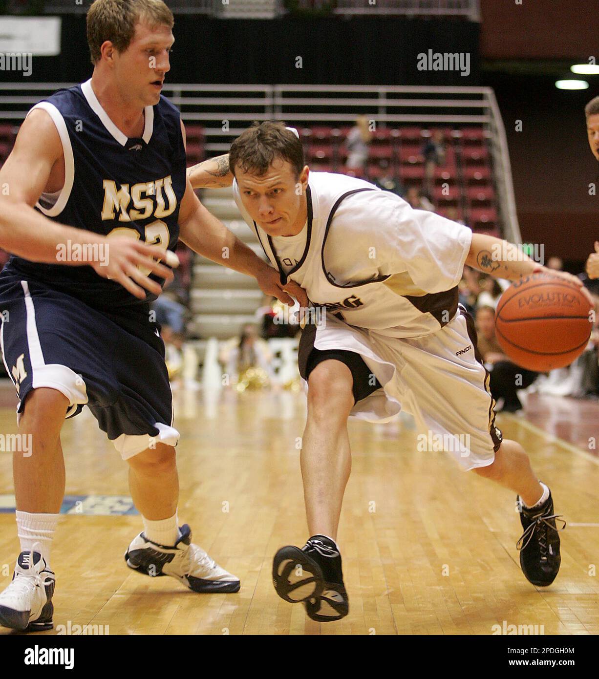 Wyoming's Steve Leven drives past Montana State defender Nick Dissly ...