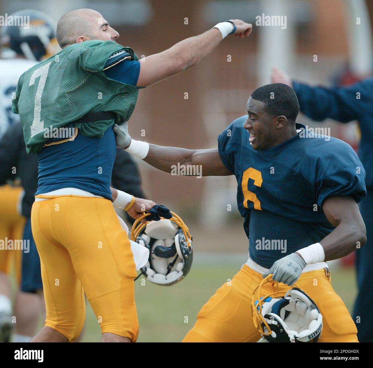 Toledo quarterback Bruce Gradkowski, left, and safety Keon Jackson ...