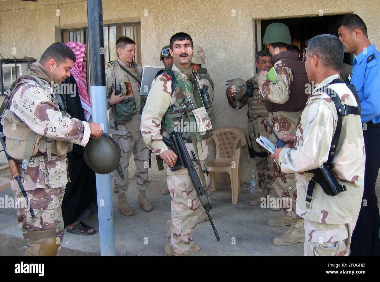 Iraqi Army Col. Saman Talabani, center, leaves a meeting with city ...
