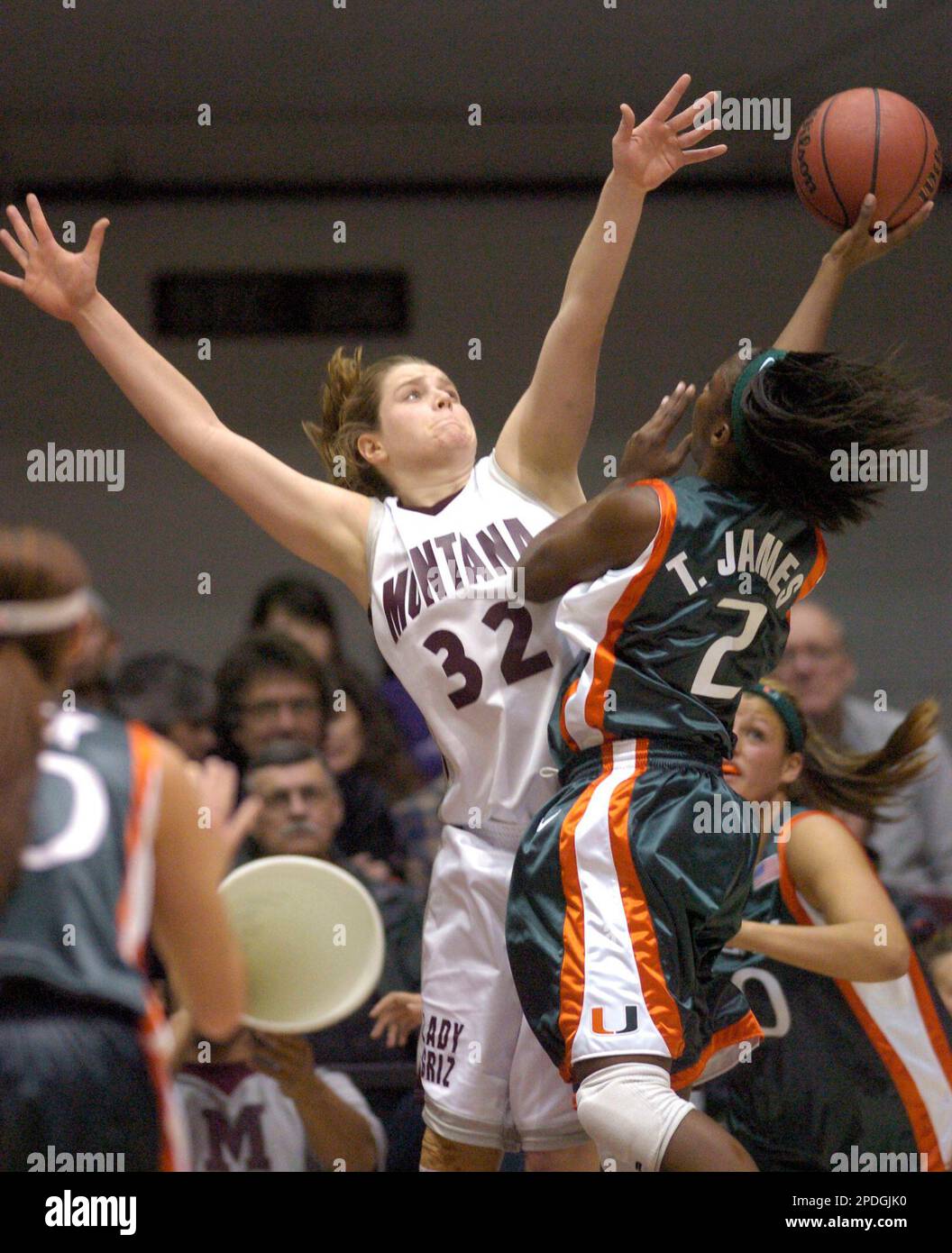 Miami's Tamara James (2) puts up a shot as Montana's Sara Gale (32 ...