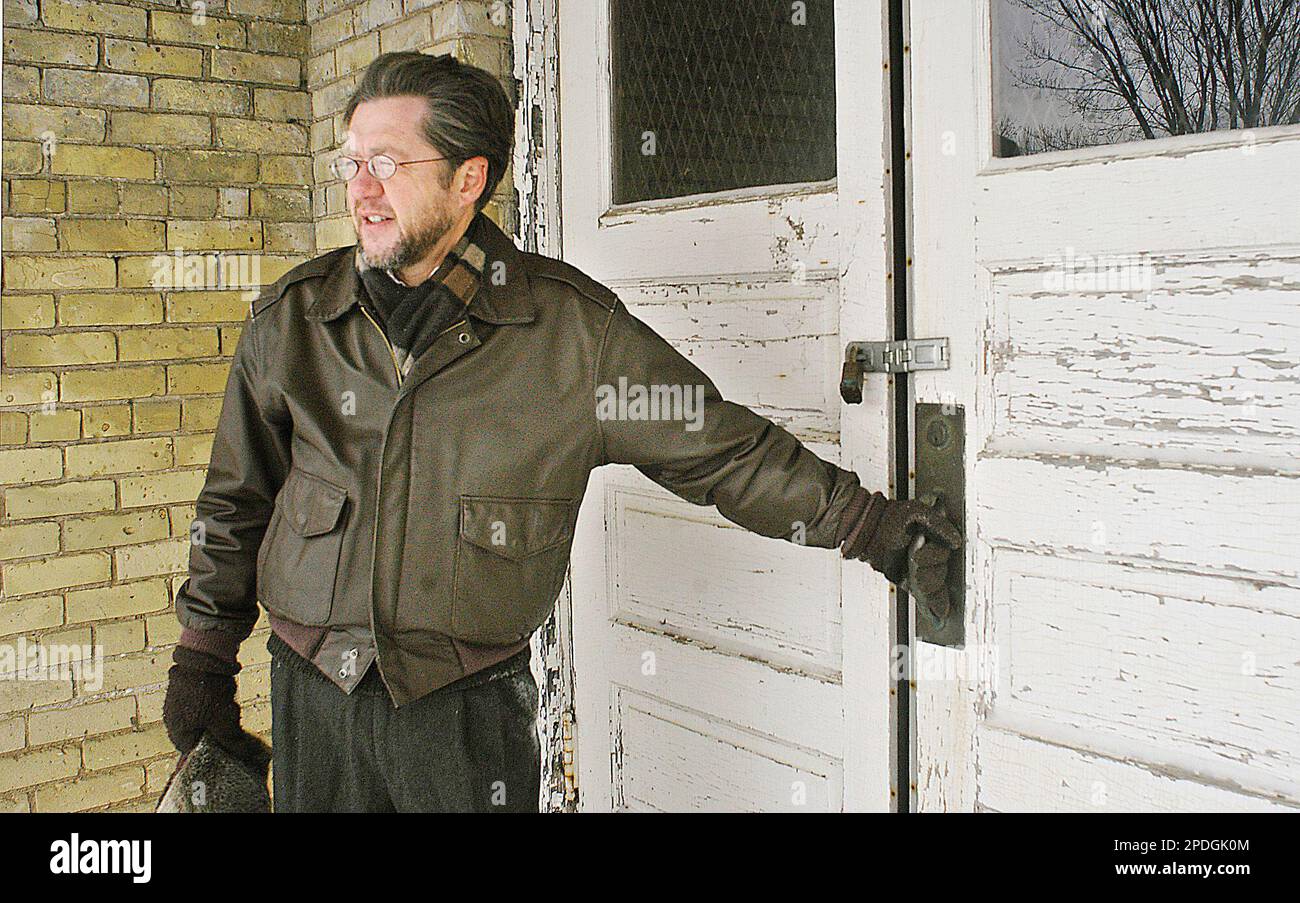 Stephen Osman, site manager at Historic Fort Snelling, reaches for a ...