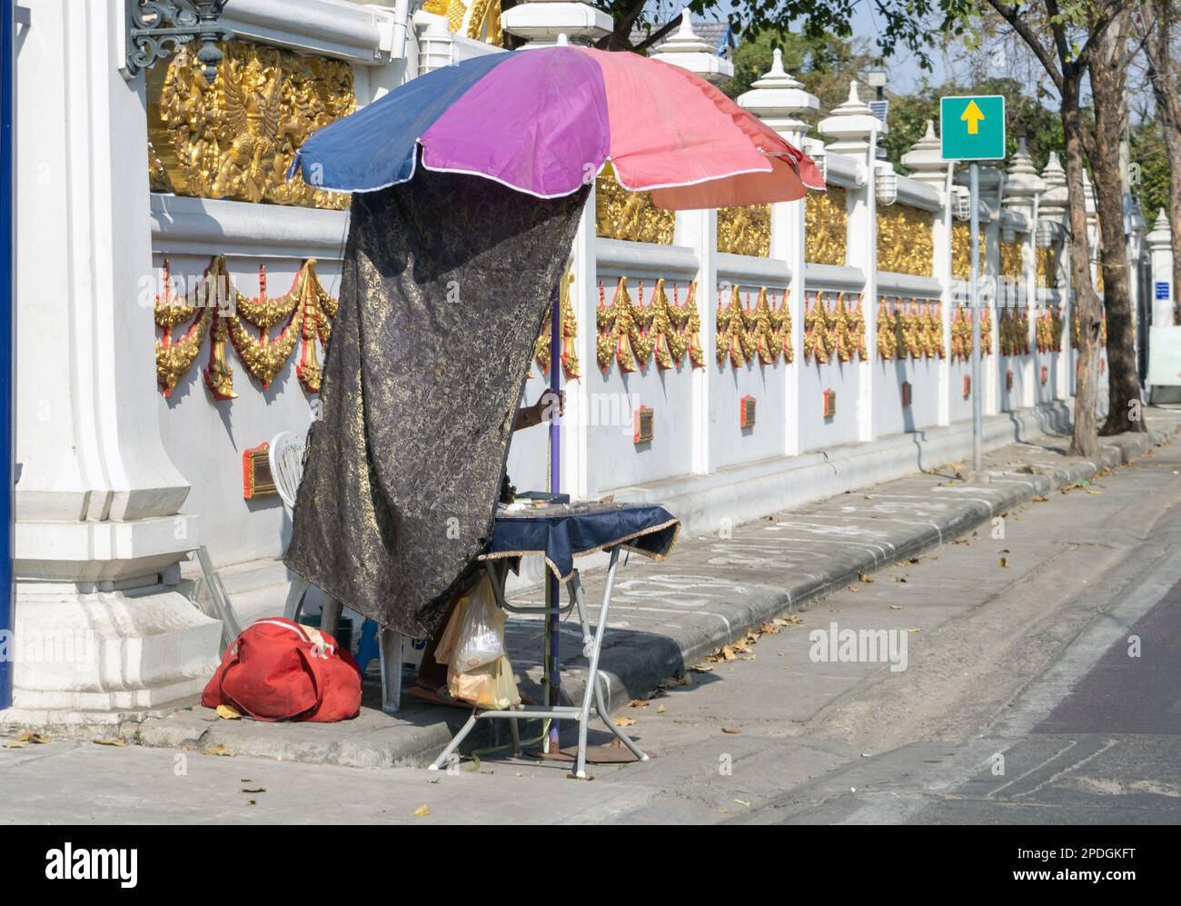 Selling religious souvenirs and items in front of the entrance to the ...