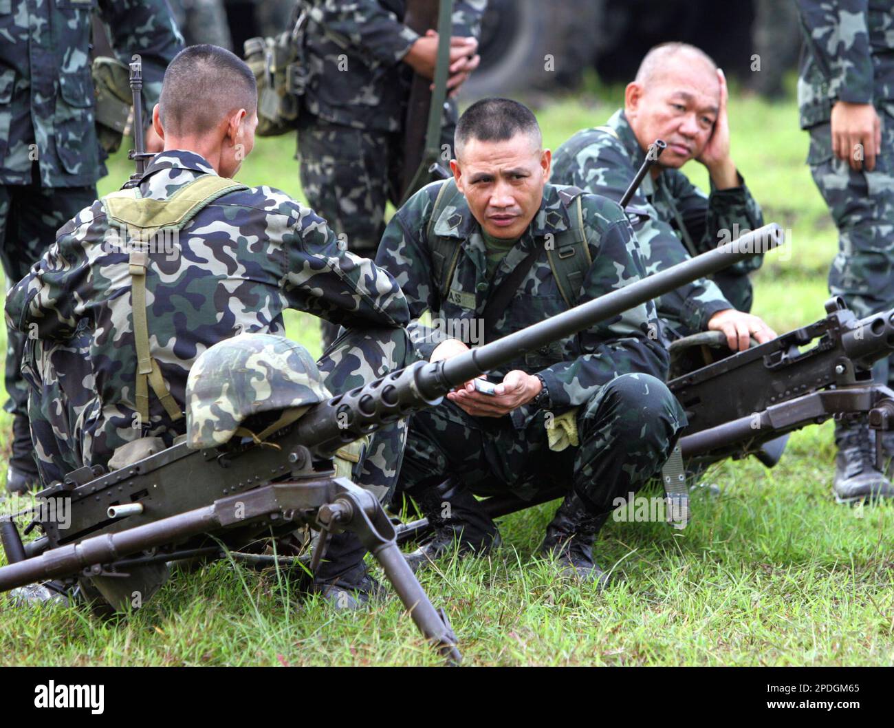 Members of the Philippine Marine Ready Force sit on a 50 caliber ...