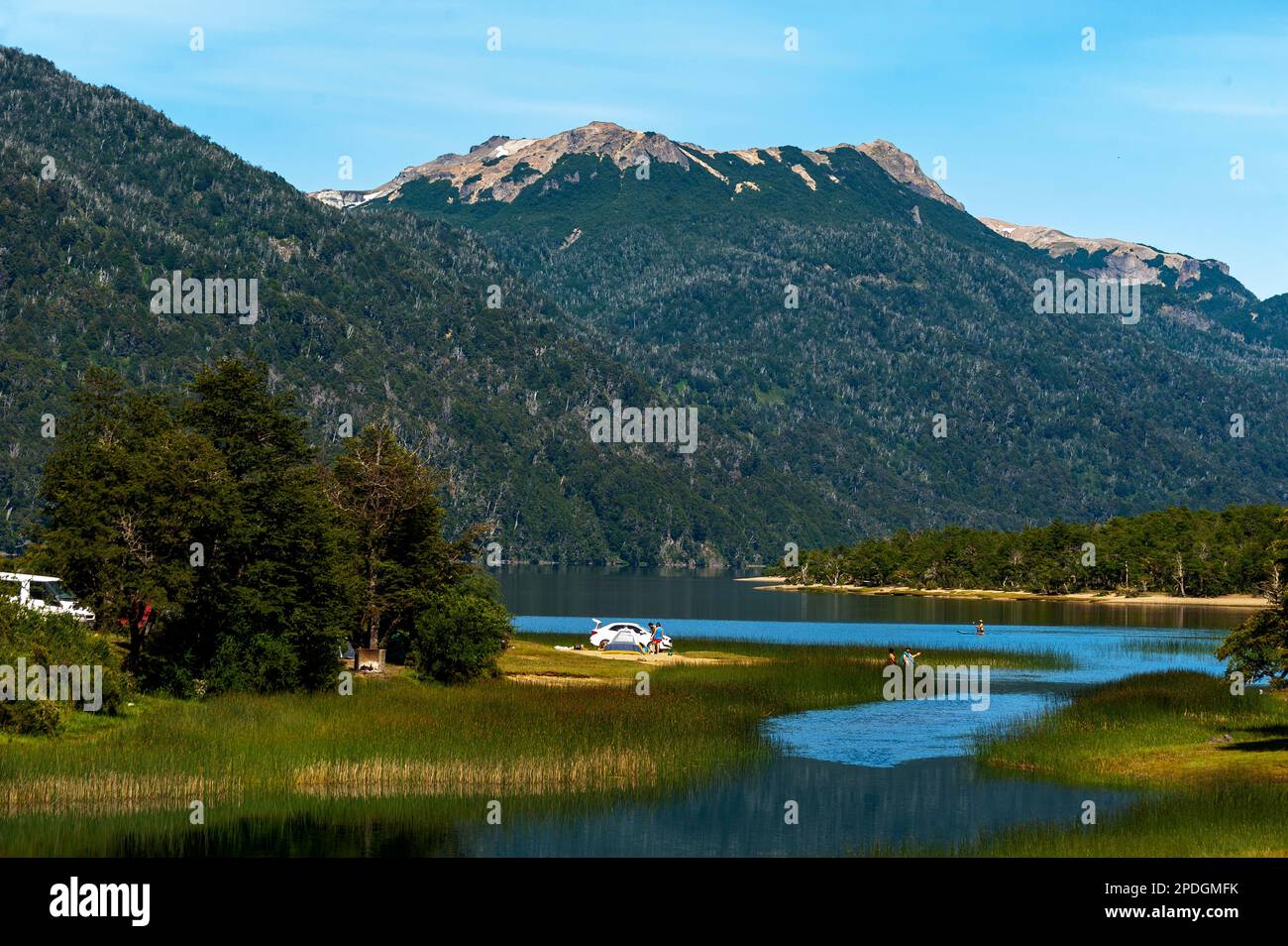 Campground on the shores of Lake Villarino on Ruta 40, snowy peaks in ...