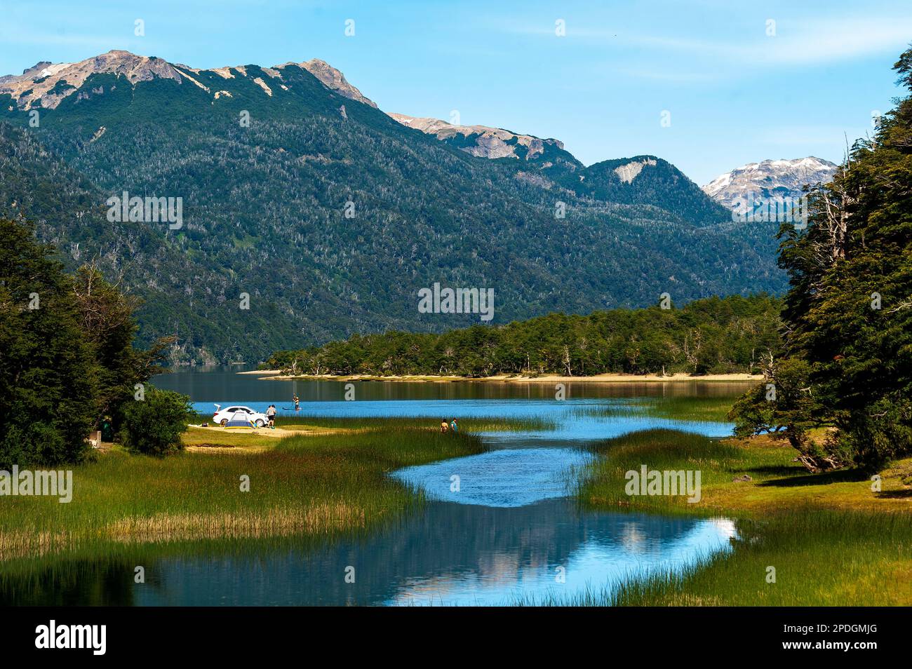 Campground on the shores of Lake Villarino on Ruta 40, snowy peaks in ...