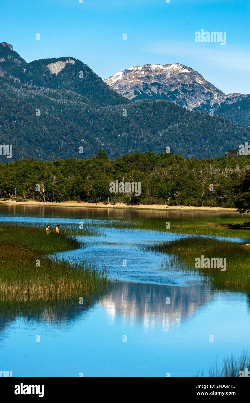 Campground on the shores of Lake Villarino on Ruta 40, snowy peaks in ...