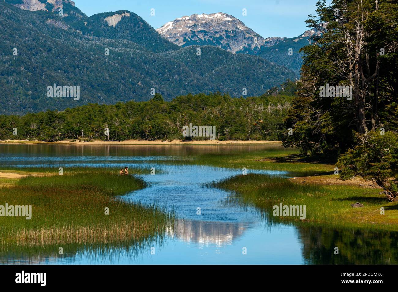 Campground on the shores of Lake Villarino on Ruta 40, snowy peaks in ...