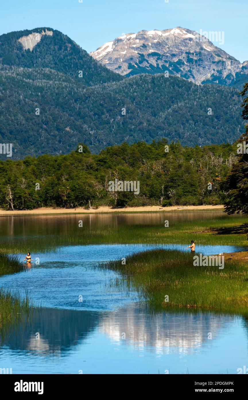 Campground on the shores of Lake Villarino on Ruta 40, snowy peaks in ...