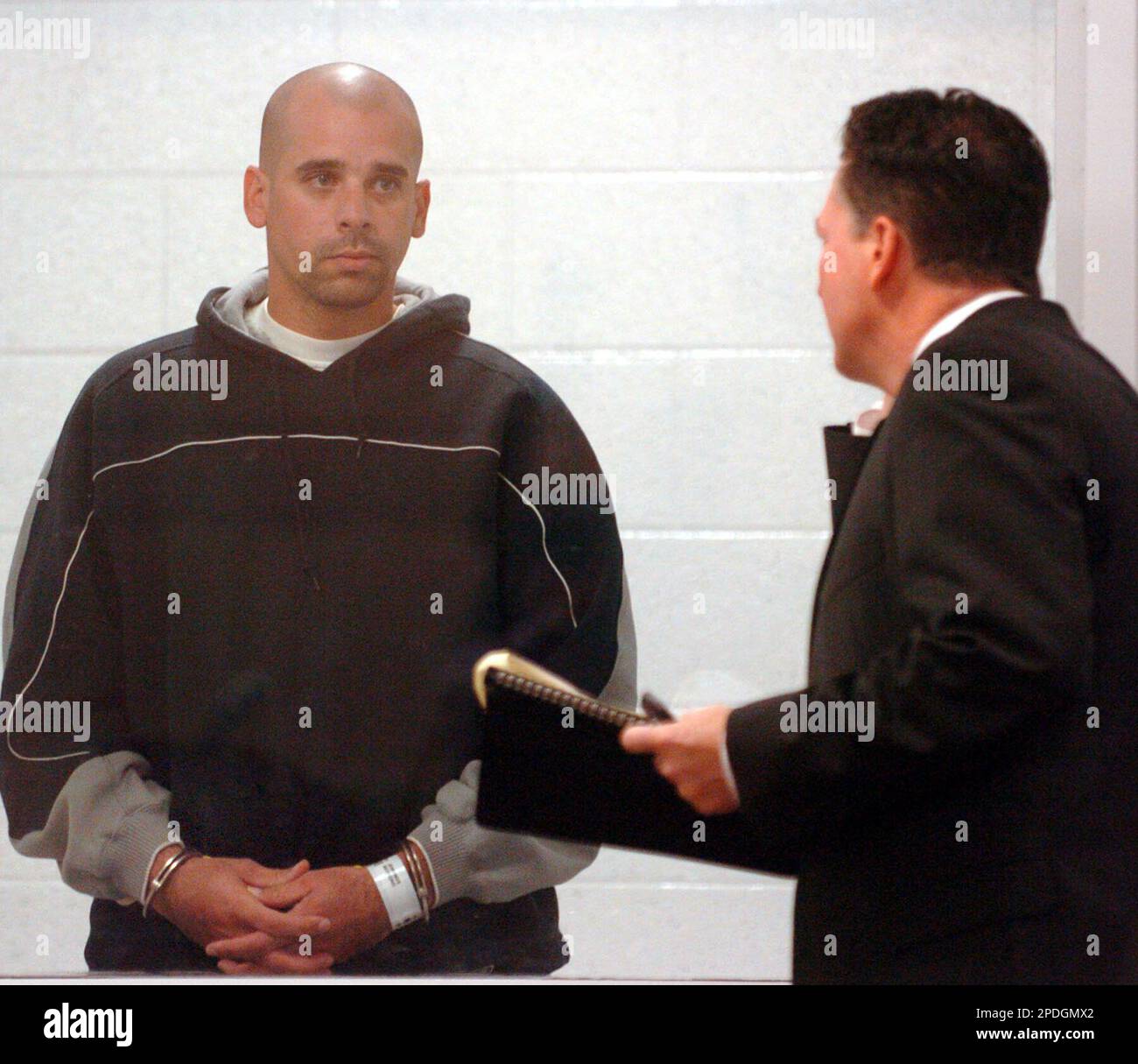 Raymond Lee Jennings, left appears with public defender John Henderson ...