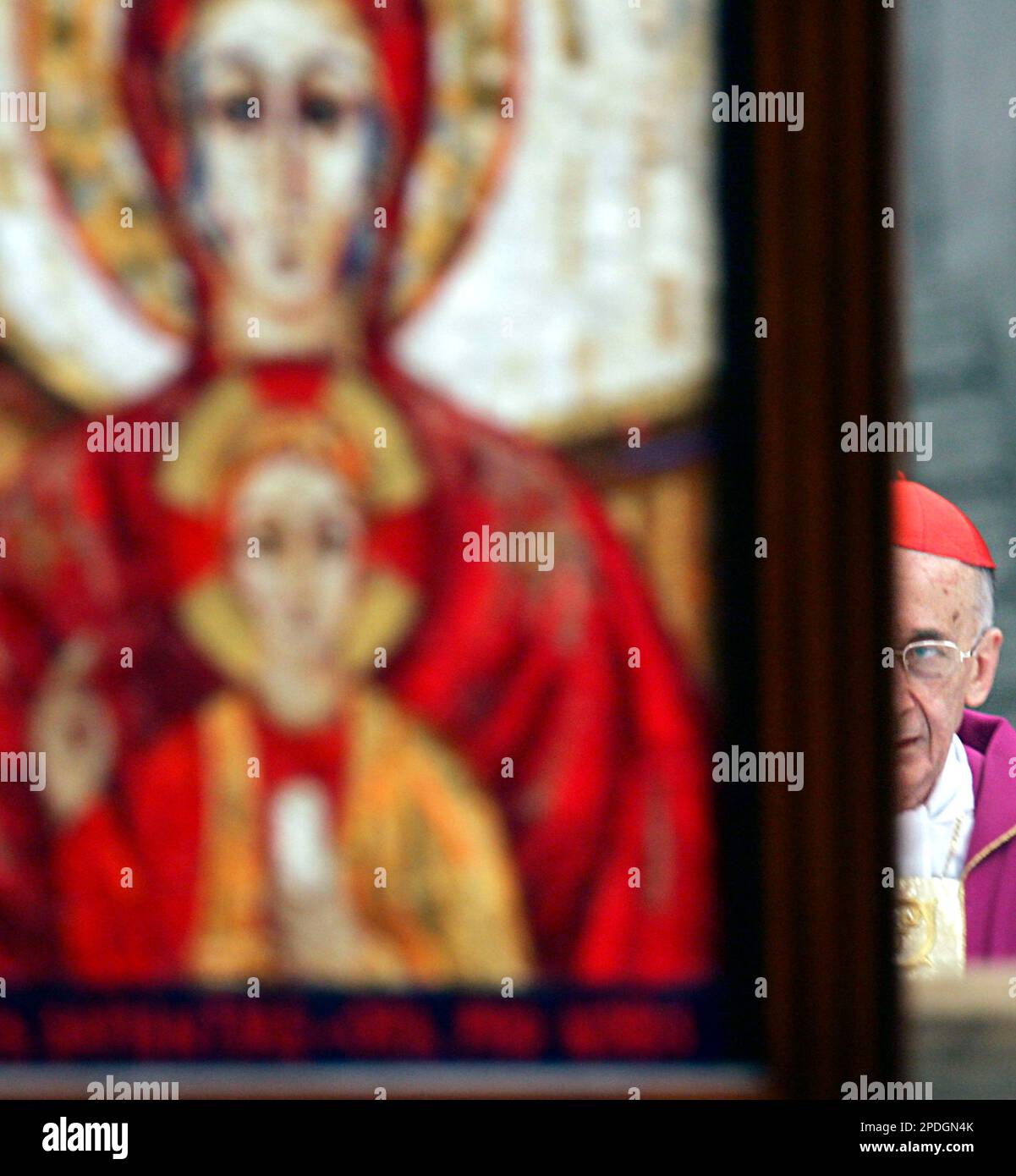 Cardinal Camillo Ruini is seen behind an icon of the virgin Mary and ...