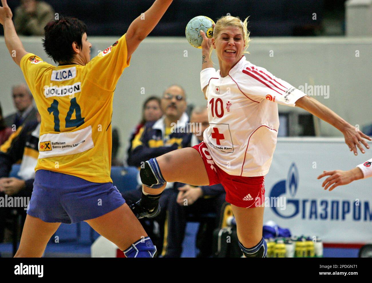 Denmark's Rikke Horlykke Jorgensen, right, attacks as Romania's Steluta ...