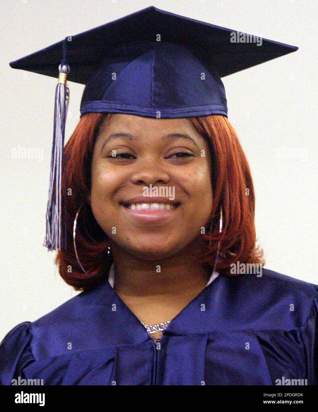 High school graduate Constance Harrison smiles as her name is called to ...