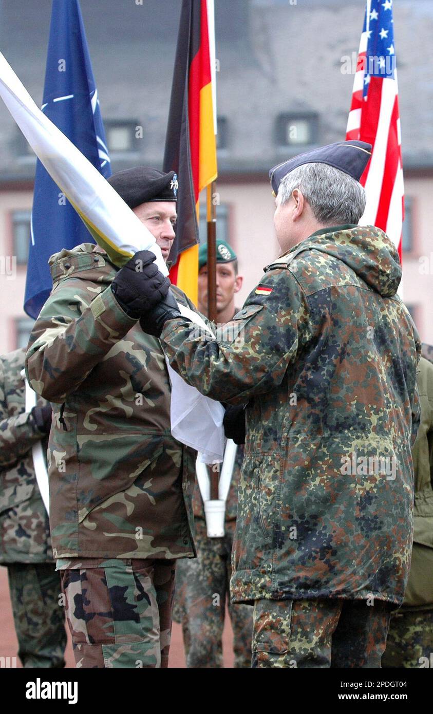 German General Gerhard Back, right, advances the NATO colors to U.S. Lt ...