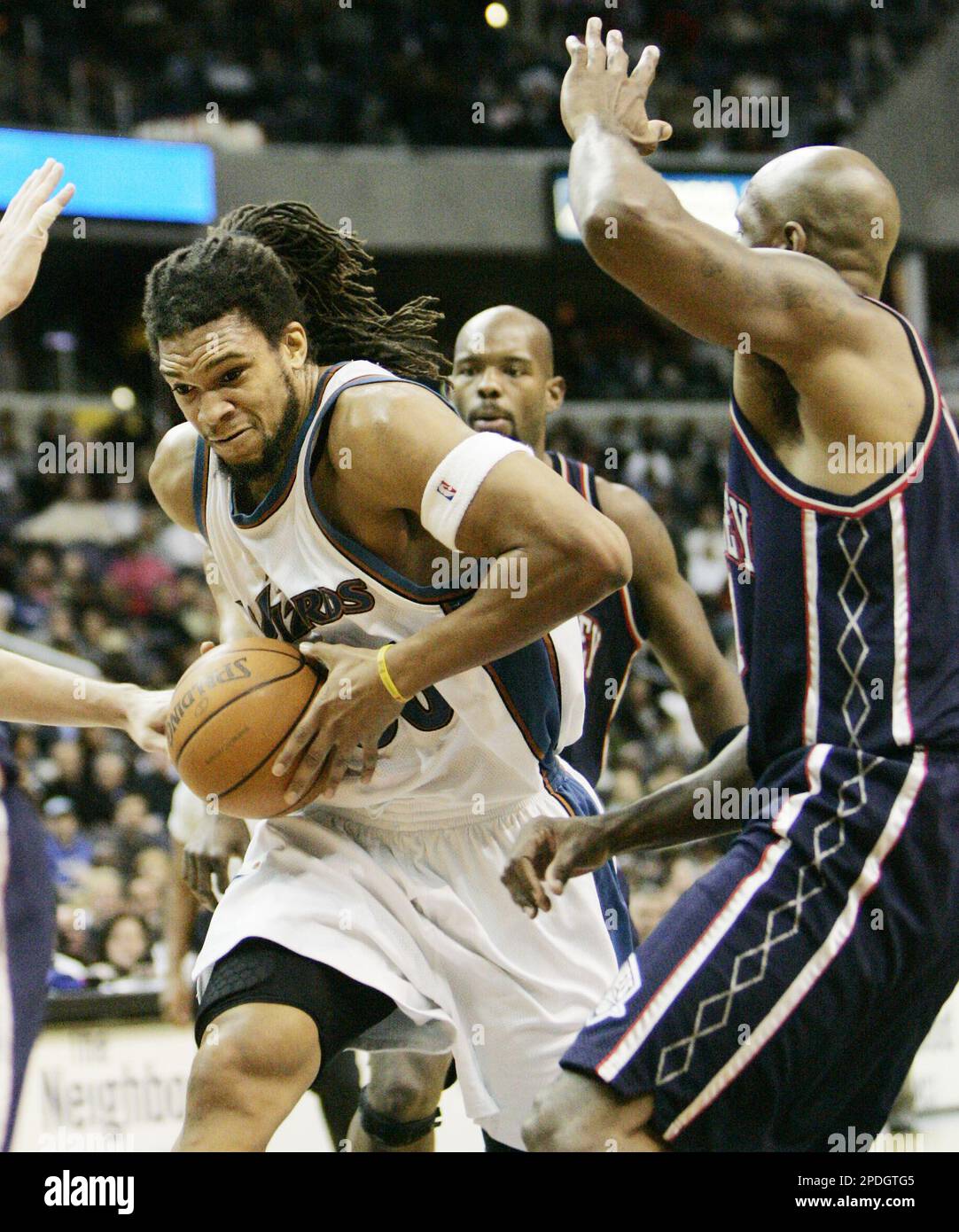 Washington Wizards' Ethan Thomas, left, drives against New Jersey Nets ...