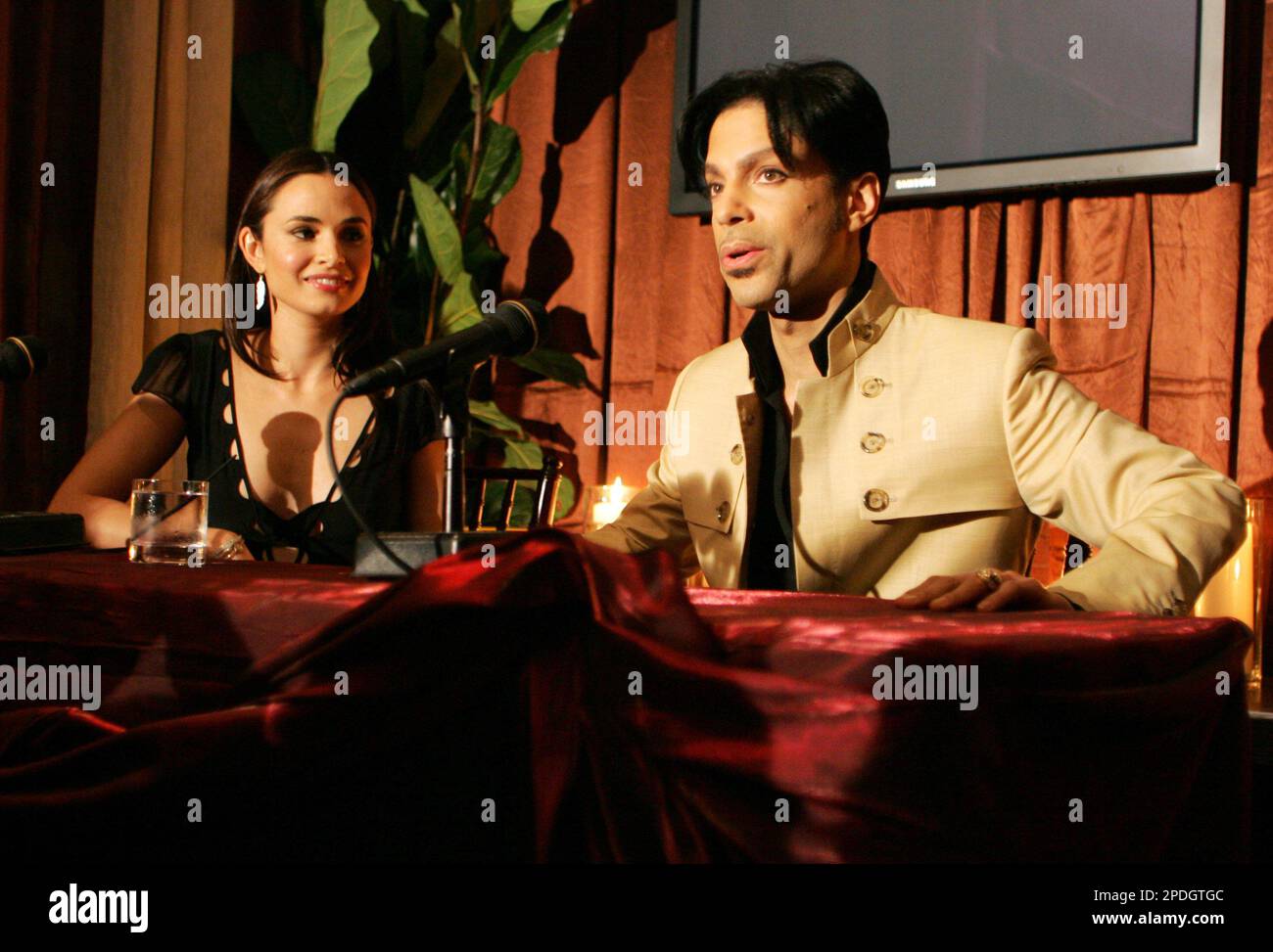 Recording artist Prince, right, speaks during a news conference about ...