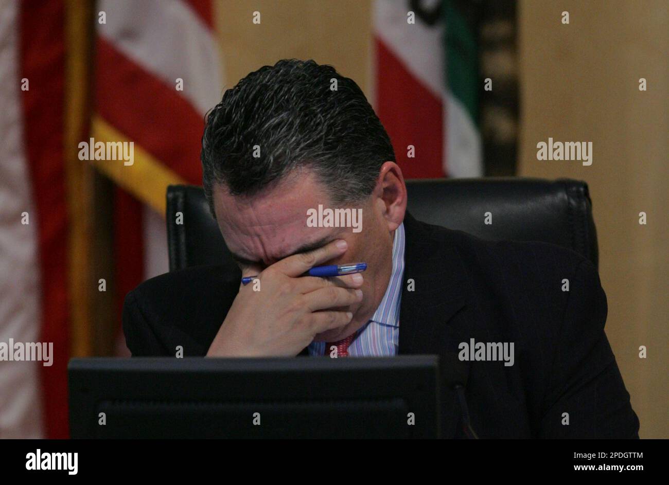 San Jose Mayor Ron Gonzales wipes his eyes after he apologized at the ...
