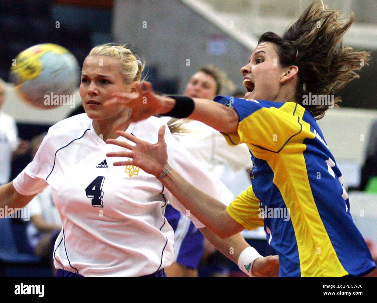 Brazil's Silvia Pinheiro, right, attacks while Ukraine's Tetyana ...