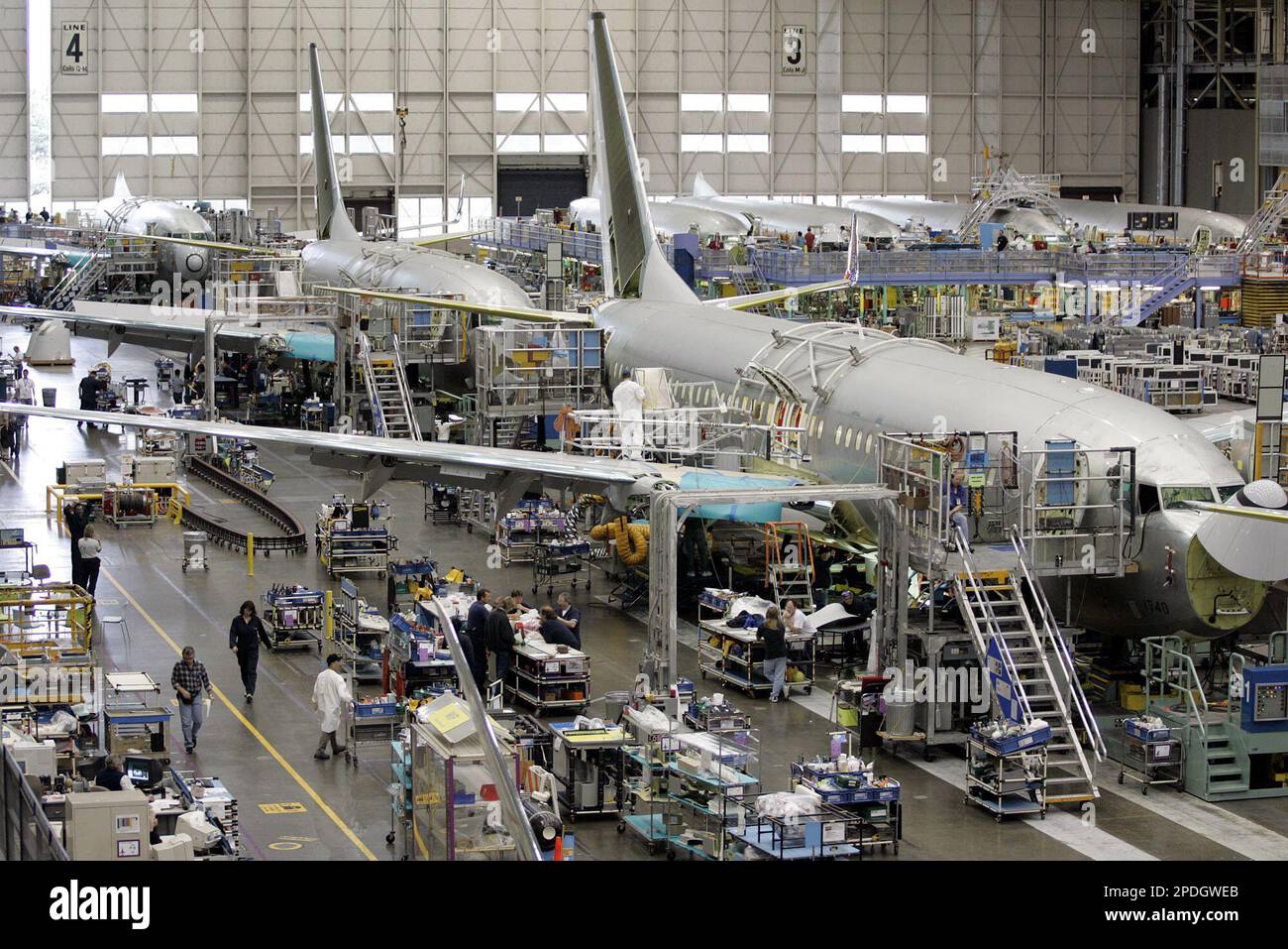 ** FILE ** Workers at the Boeing Co.'s Renton, Wash. assembly plant ...