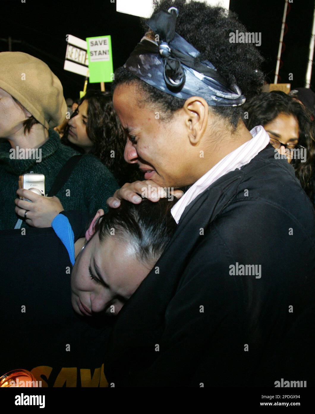 Unidentified women hug and cry outside of San Quentin State prison in ...