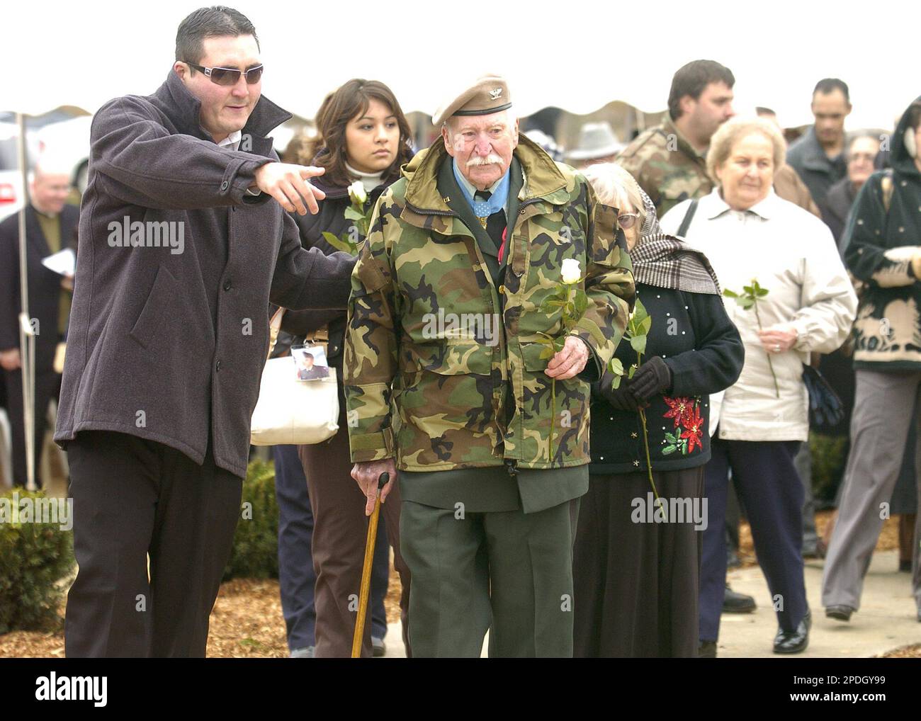 Joseph Millett, left, helps his grandfather, Col. Lewis Millett, find a ...