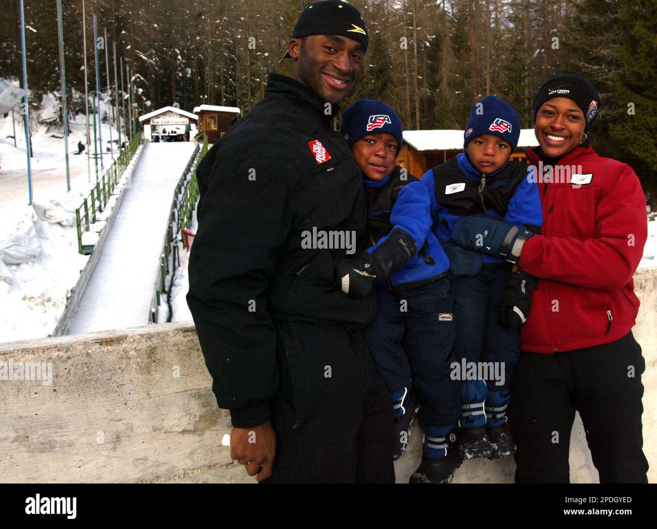 U.S. bobsledder Vonetta Flowers, right, her husband Johnny, left, and ...