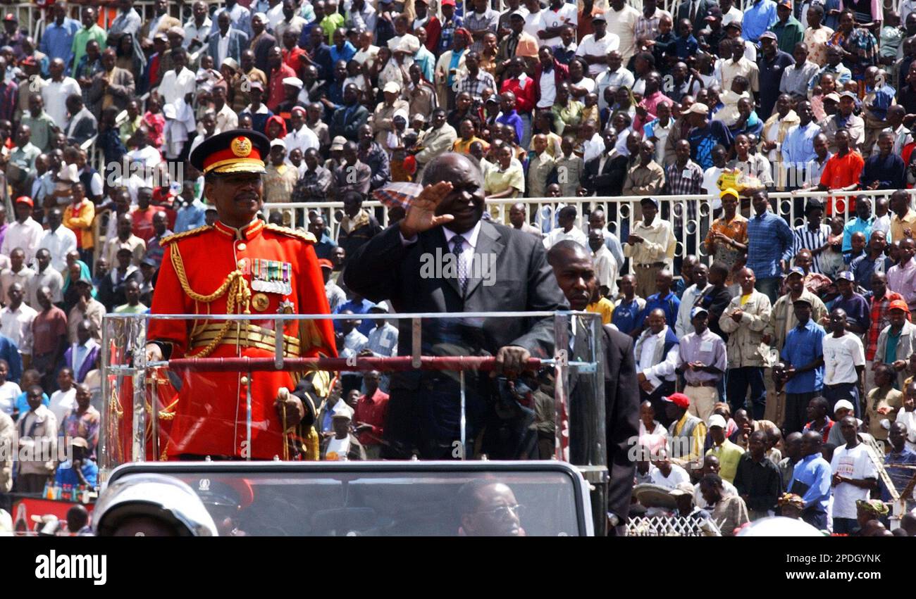 Kenya's President Mwai Kibaki, right, accompanied by Kenya's Chief of ...