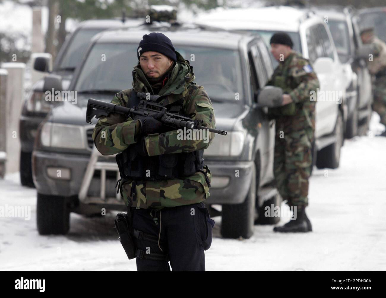 NATO troops search the home of a man suspected of belonging to the ...