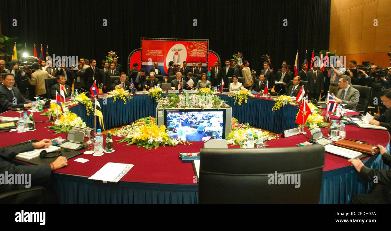 ASEAN leaders sit round the table at the plenary session of the 11th ...