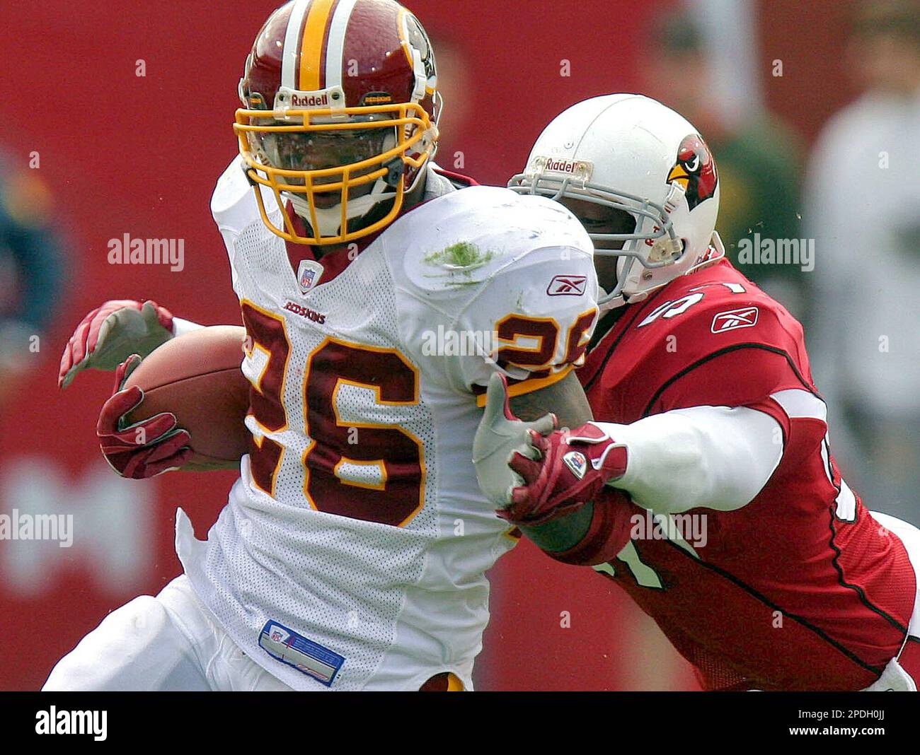 Arizona Cardinals' Orlando Huff, right, tries to pull down Washington ...