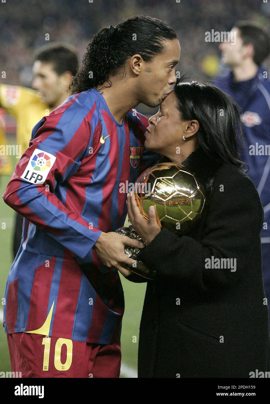 Brazilian soccer star Ronaldinho, left, kisses his mother Miguelina as ...