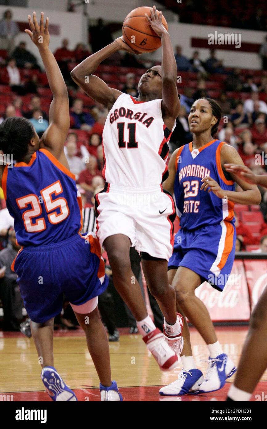 Georgia guard Sherill Baker (11) shoots as Savannah State University ...
