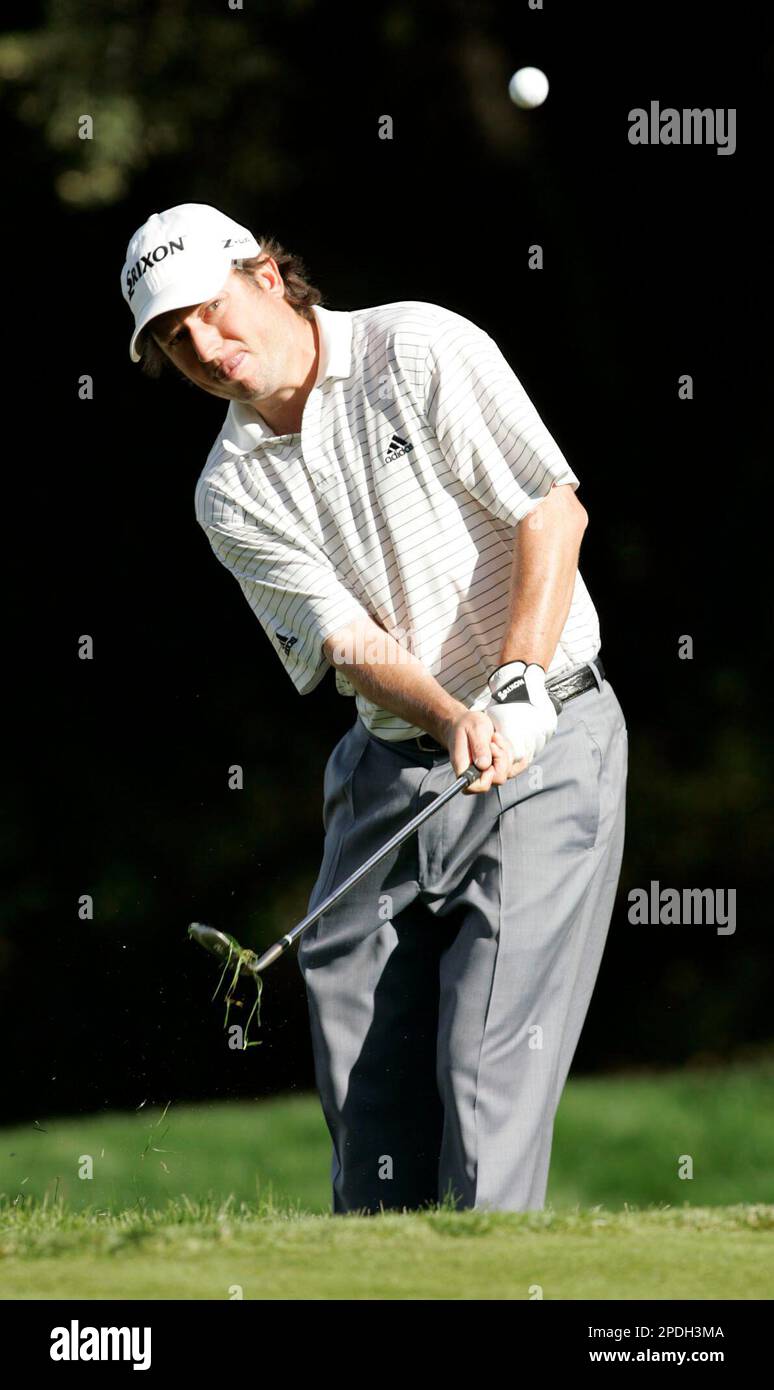 David Howell of Great Britain chips the ball onto the fifth green ...
