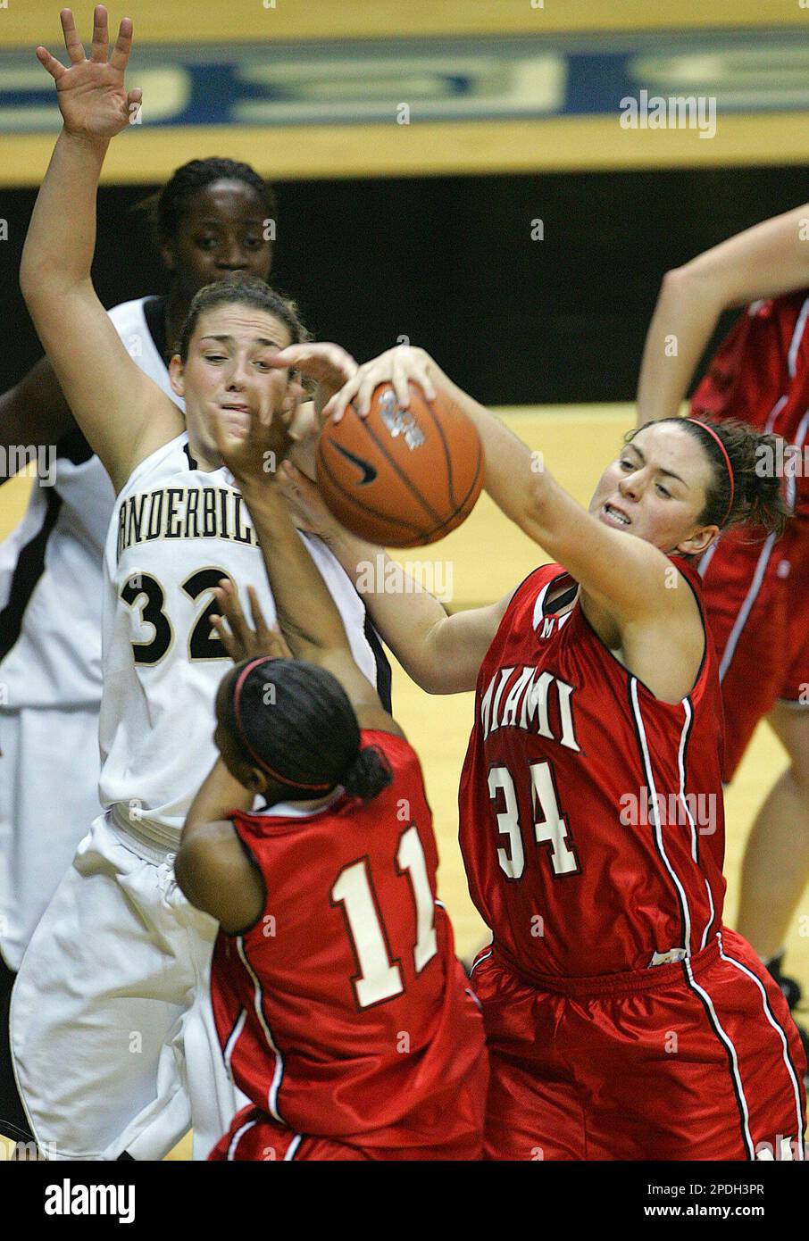 Miami of Ohio's Katie Guerriero (34) and Ashley Hawkins (11) battle for ...