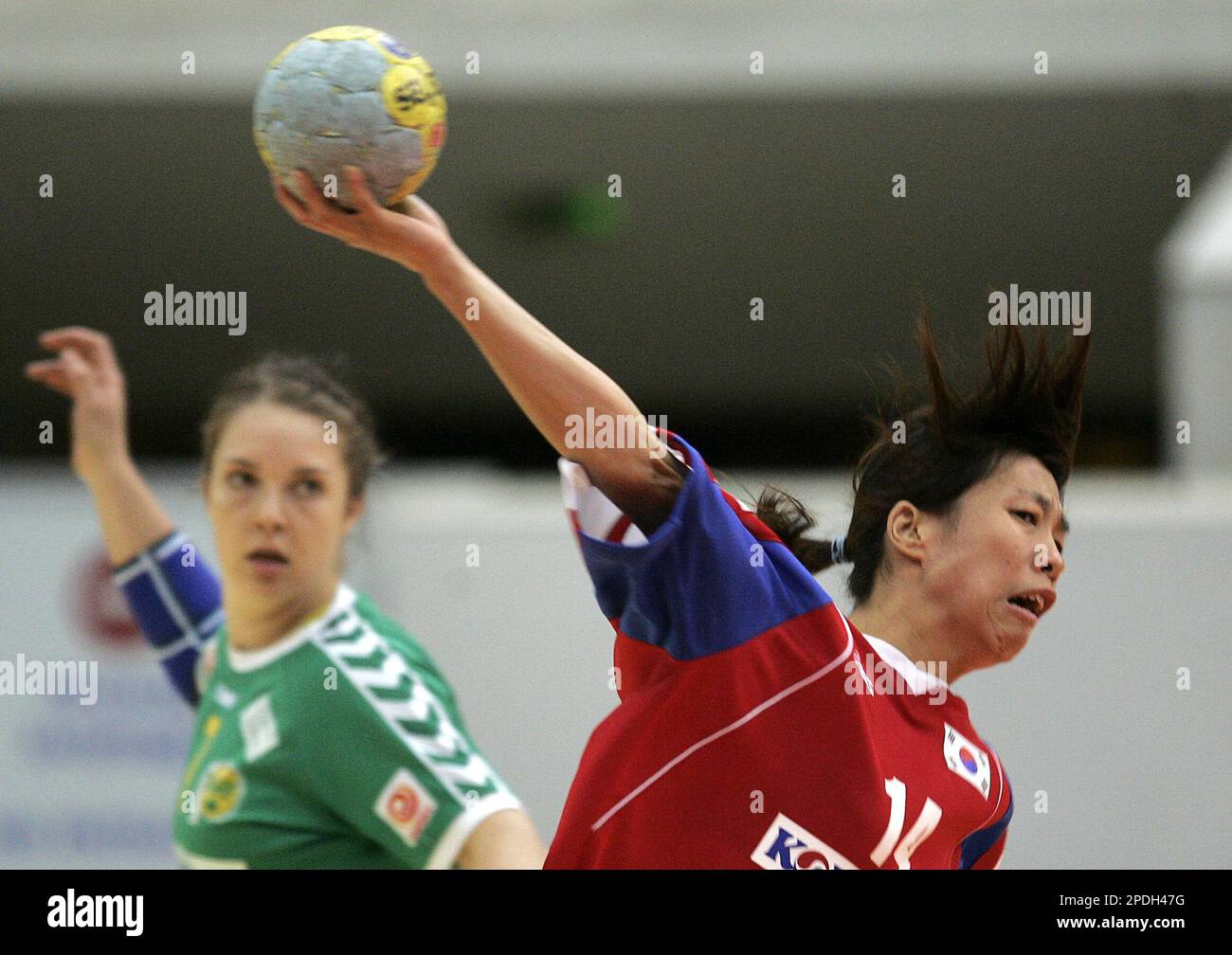 Korea's Kim Jin-Soon, right, scores as Australia's Katherine Napier ...