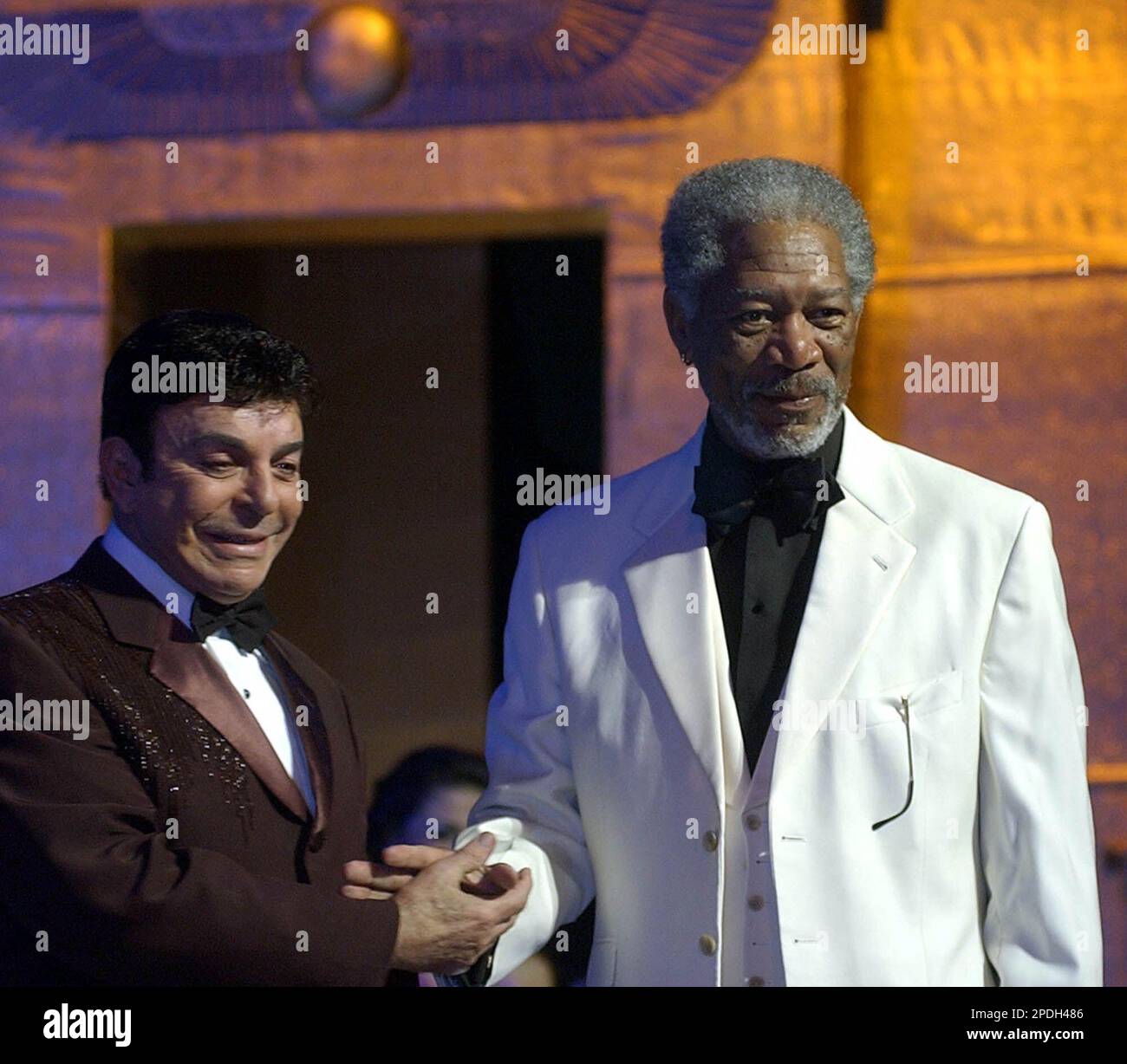 U.S. actor Morgan Freeman shakes hand with Egyptian actor Sameer Sabri ...