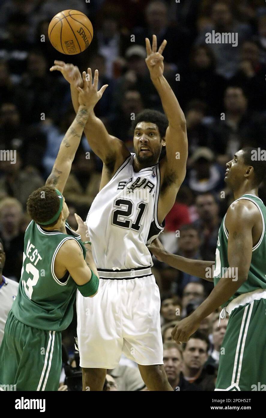 San Antonio Spurs forward Tim Duncan (21) passes the ball as he is ...