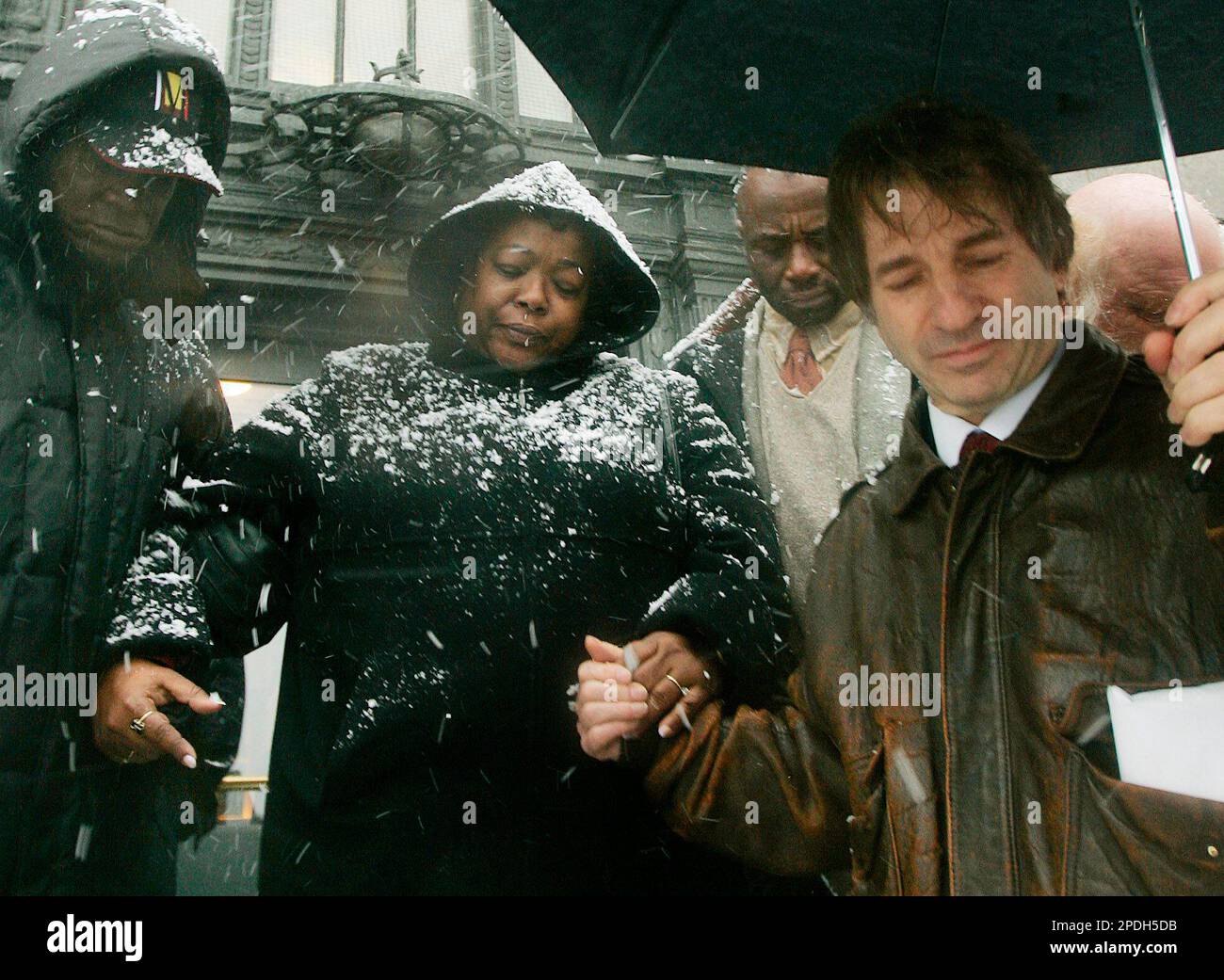 Leisa Young, mother of Sgt. Cornel Young Jr., is accompanied by her ...