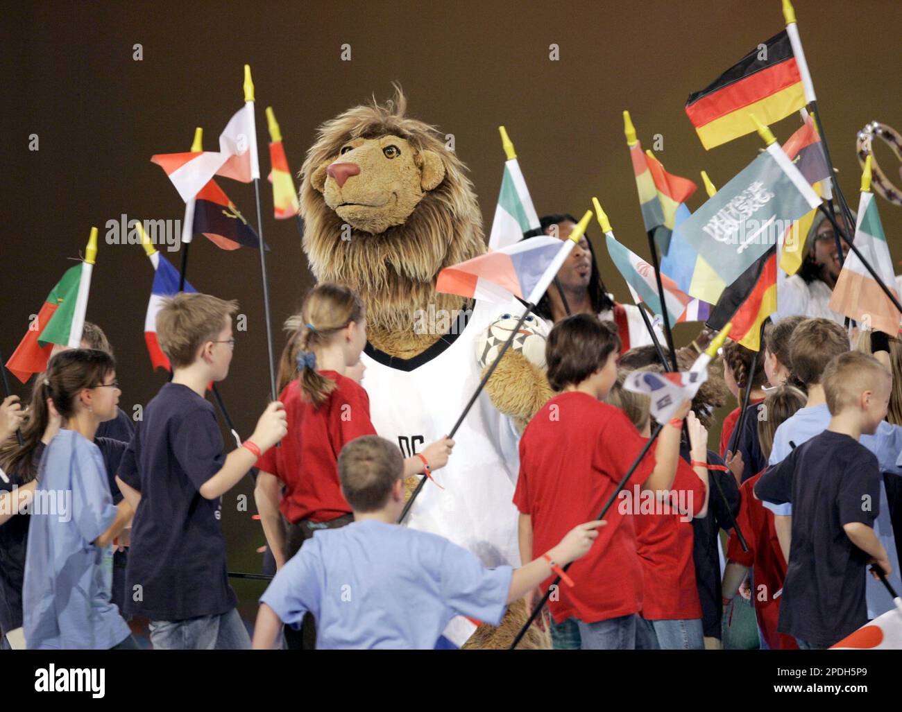 Official mascot 'Goleo' is surrounded by children carrying the national ...