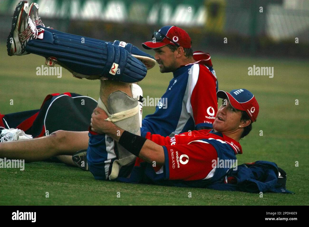 England's batsman Kevin Pietersen, front, and Steve Harmison are busy ...
