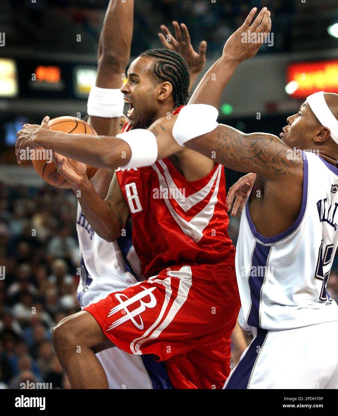 Houston Rockets guard Derek Anderson, center, loses control of the ball ...