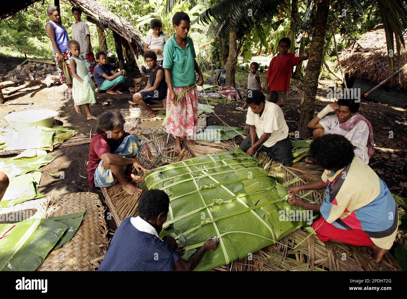 Women from the village of Volovoli on the island of Ambae, part of the ...
