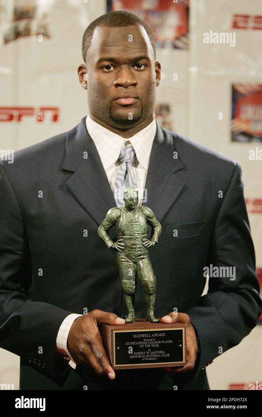 Texas quarterback Vince Young poses with the Maxwell Award given to the ...