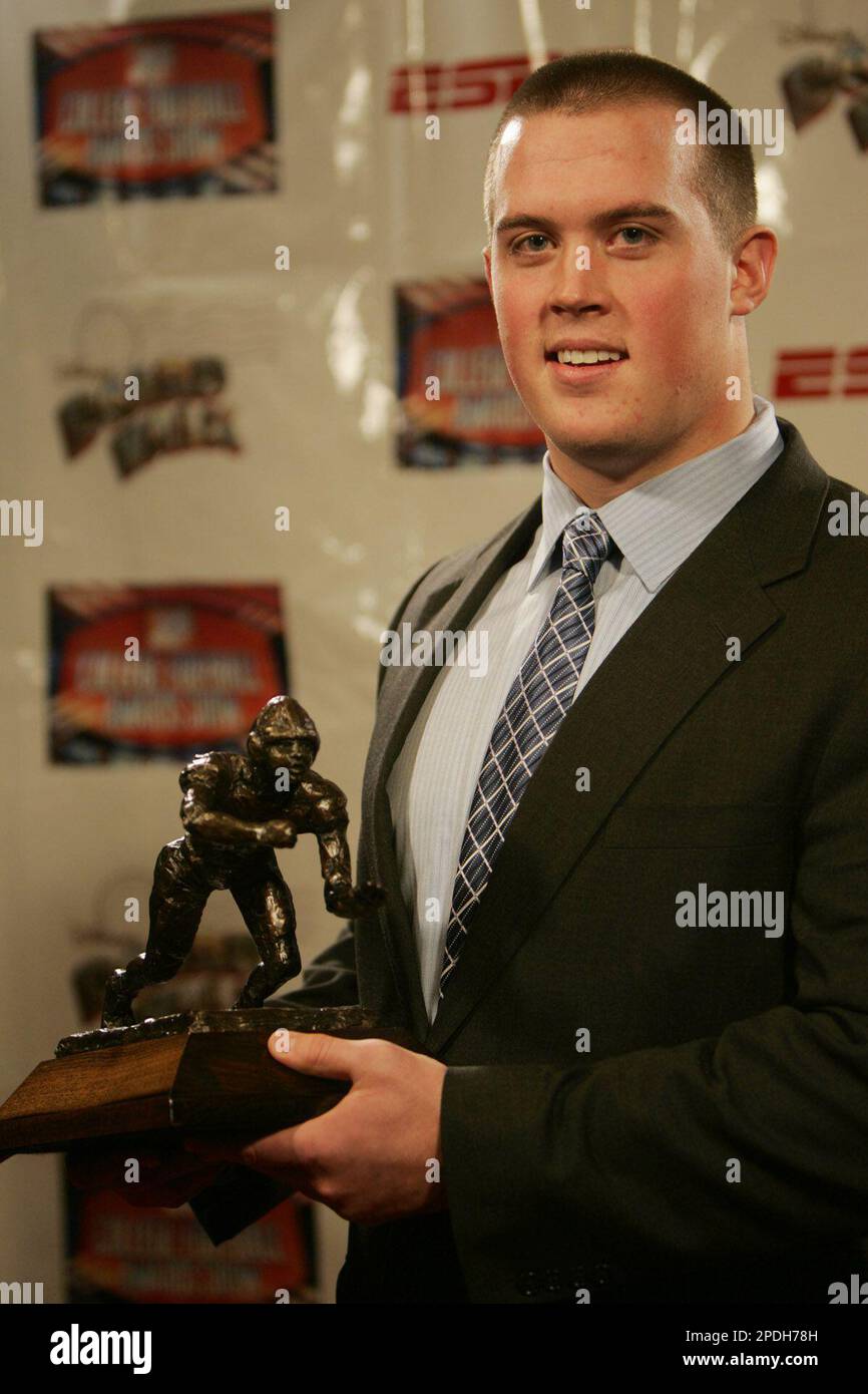 Minnesota lineman Greg Eslinger poses with the Outland Trophy as the ...