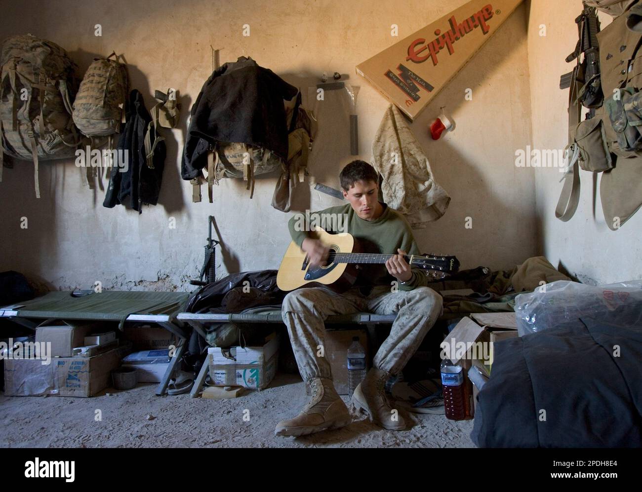 U.S. Marine Cpl. David Thibodeaux of Eunice, Louisiana, plays a song he ...