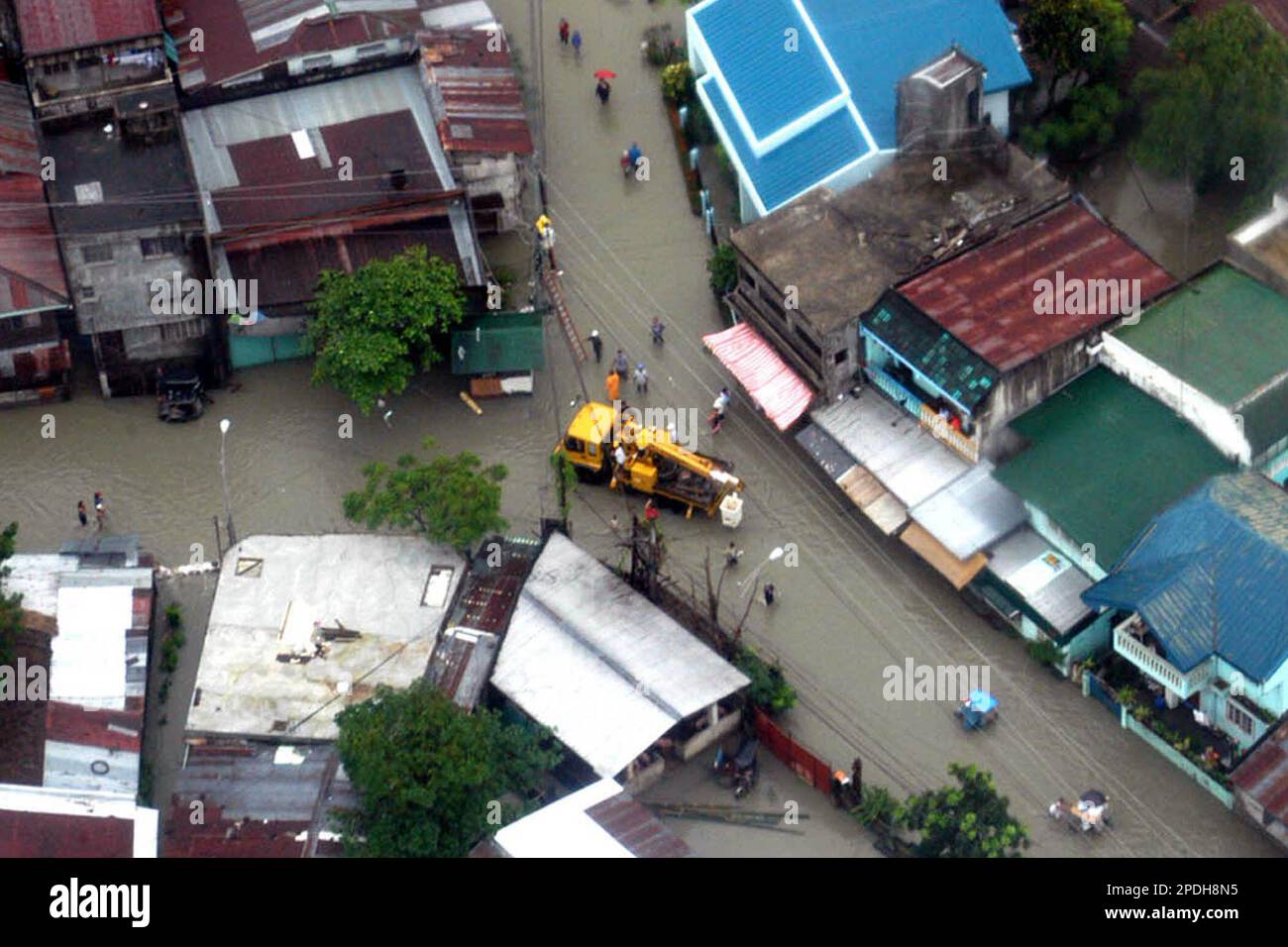 In this photo released by the Philippine Air Force, flood waters ...