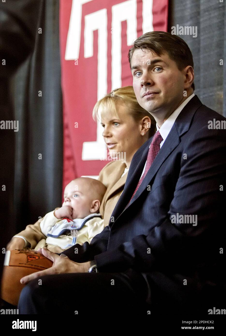 Al Golden and his wife, Kelly Elizabeth Golden, and their son, AJ, wait ...