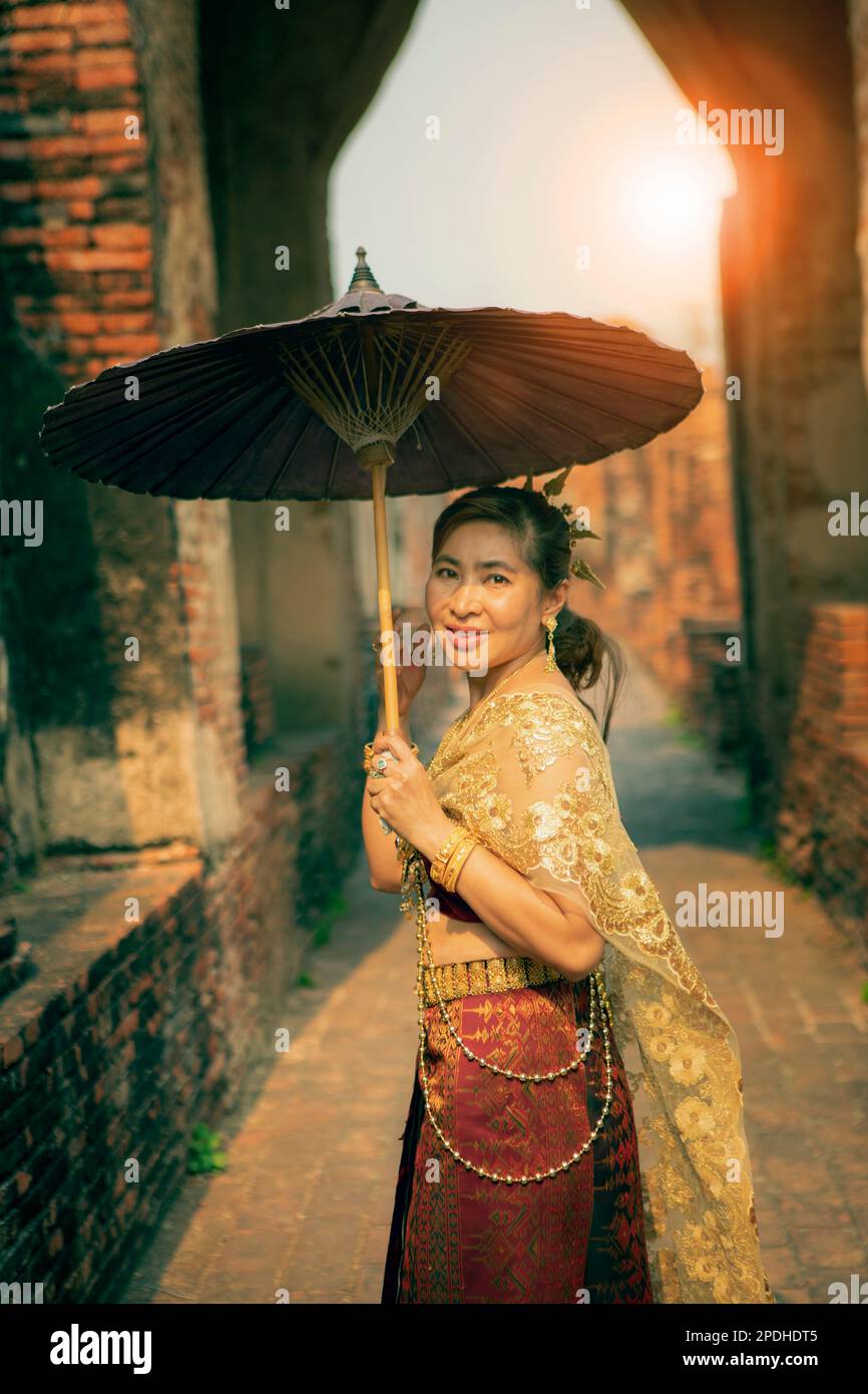 beautiful asian woman wearing thai tradition clothes holding bamboo ...