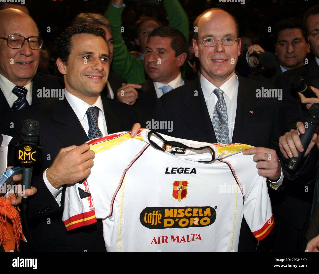 Prince Albert II of Monaco, right, is given the jersey of the Messina ...