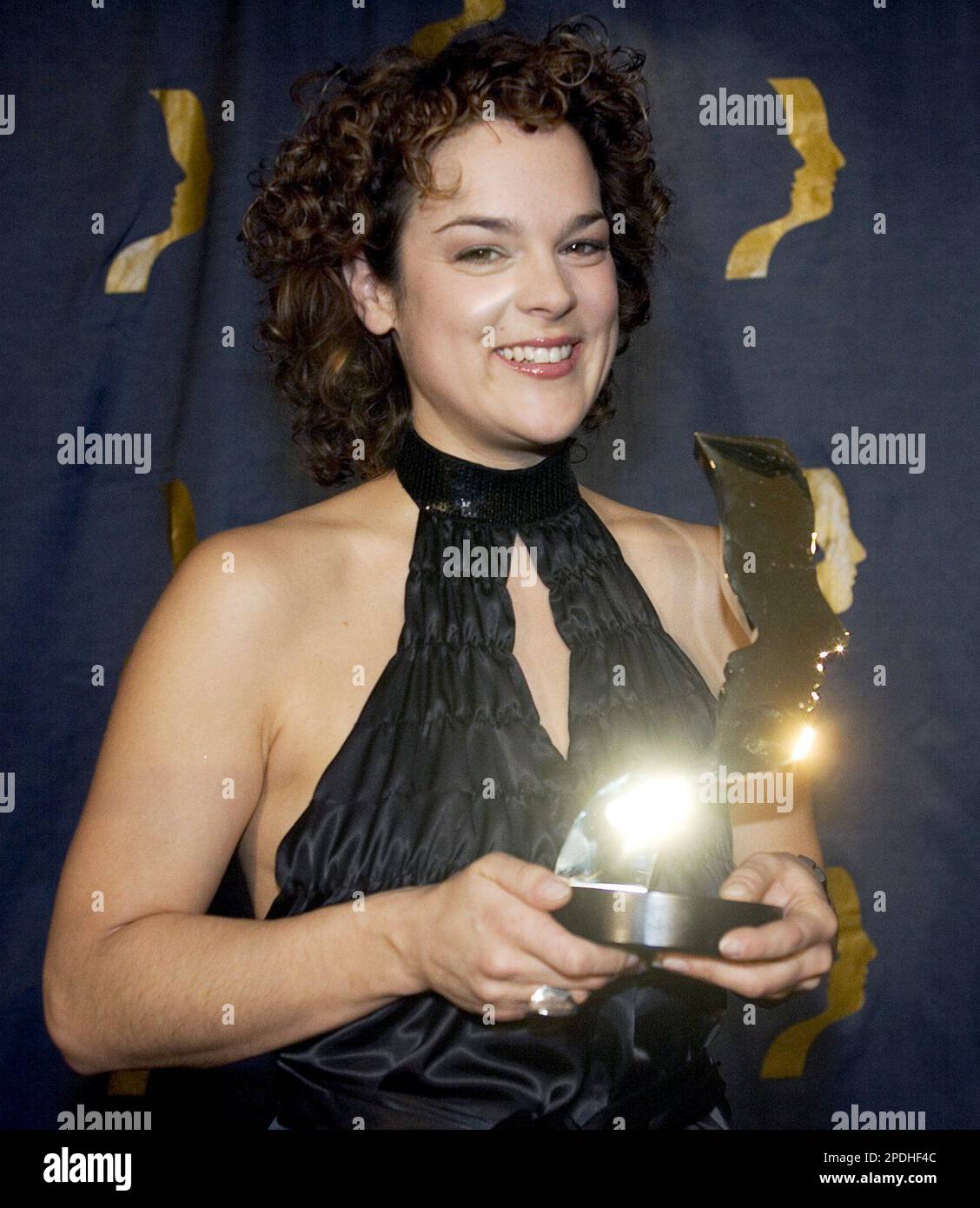 Helene Bourgeois Leclerc holds up the trophy for the best supporting ...